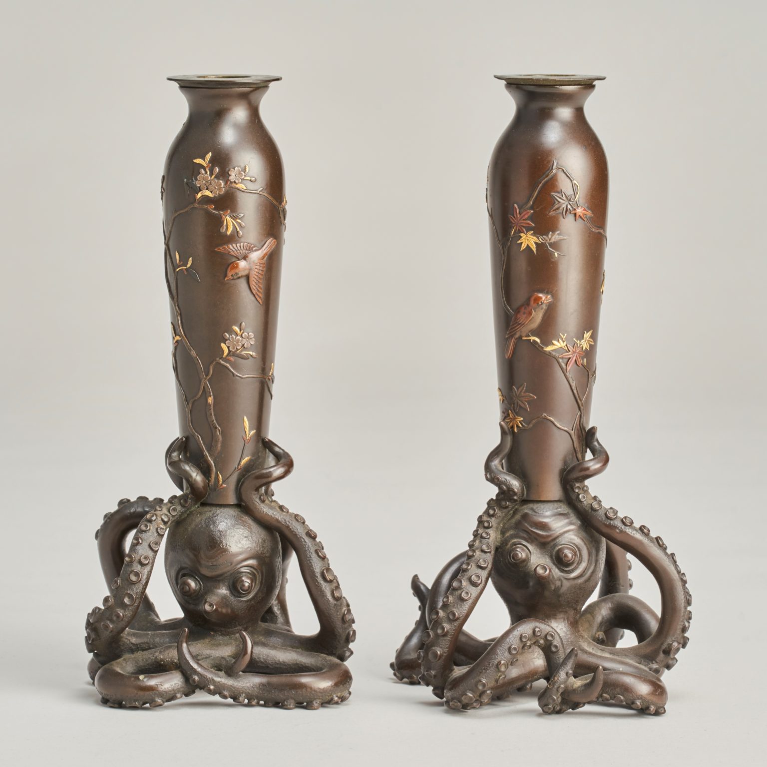 An amusing pair of Bronze and multi-metal vases supported by Octopuses ...