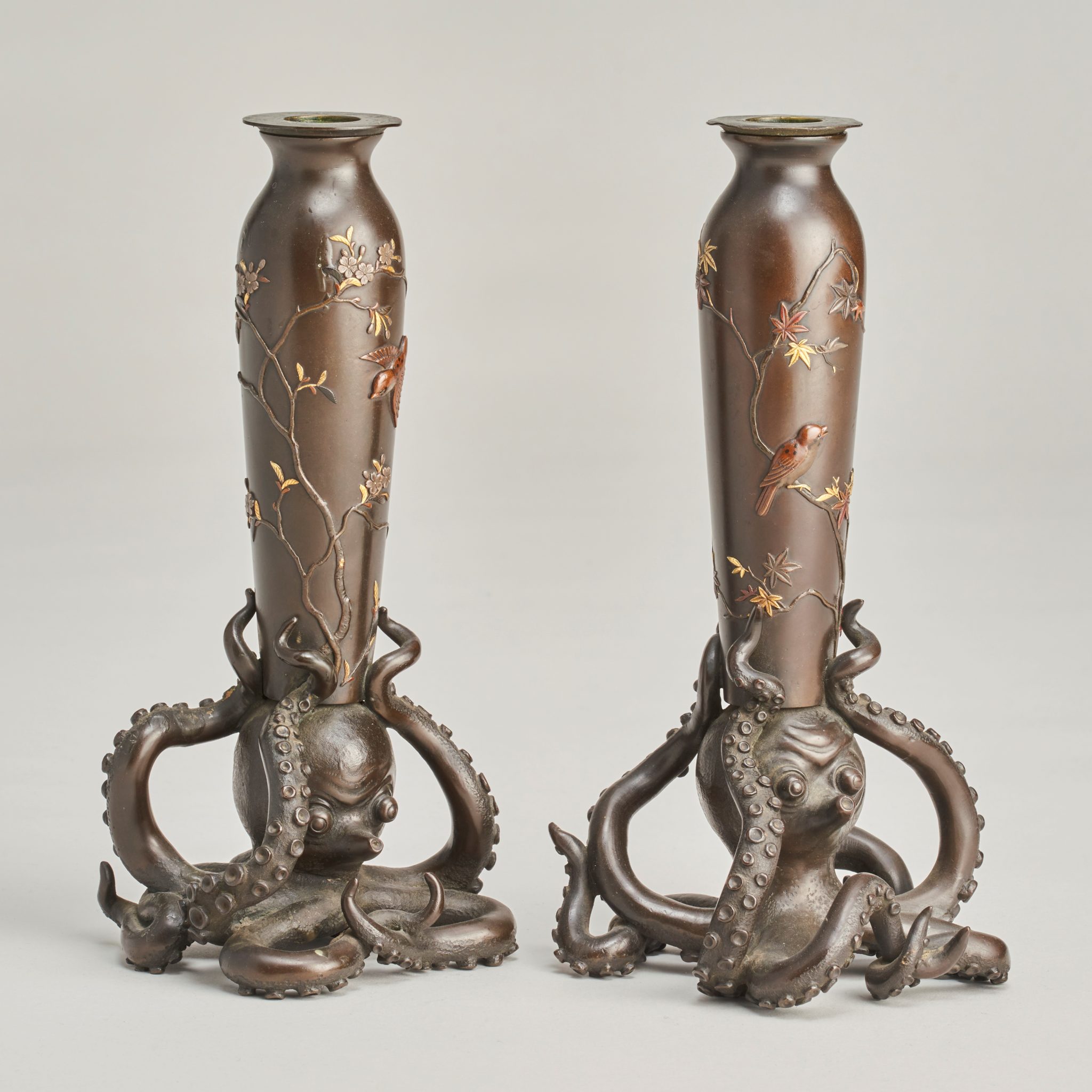An amusing pair of Bronze and multi-metal vases supported by Octopuses ...