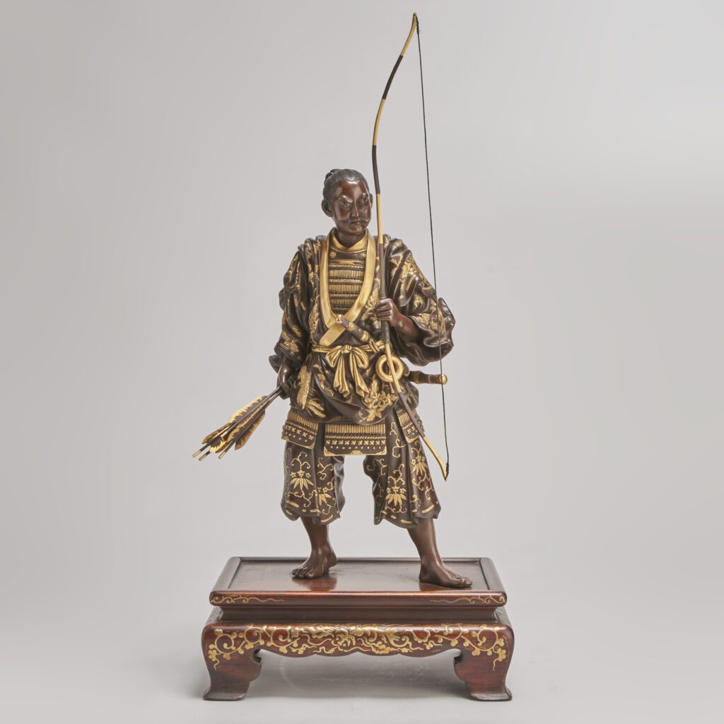 A commanding parcel gilt Bronze figure of a Samurai Archer, signed ...
