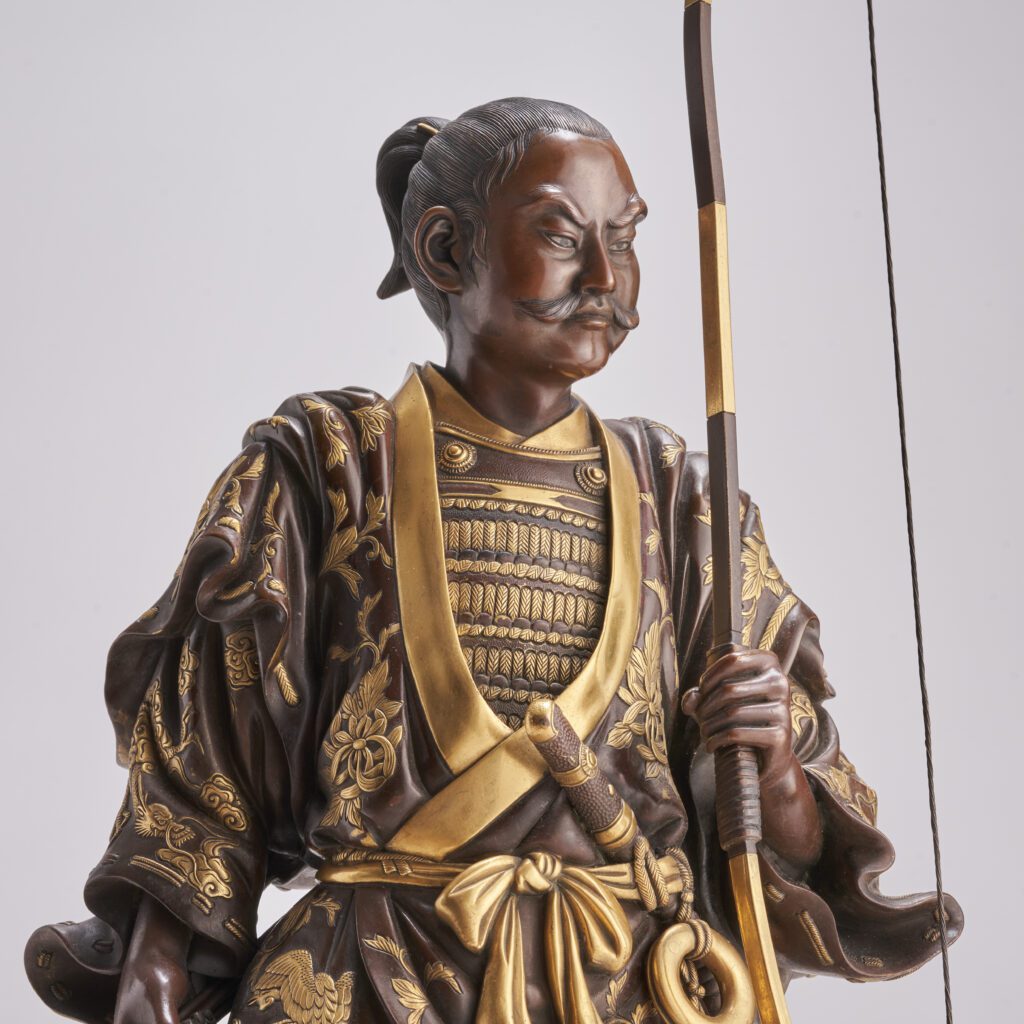 A commanding parcel gilt Bronze figure of a Samurai Archer, signed ...